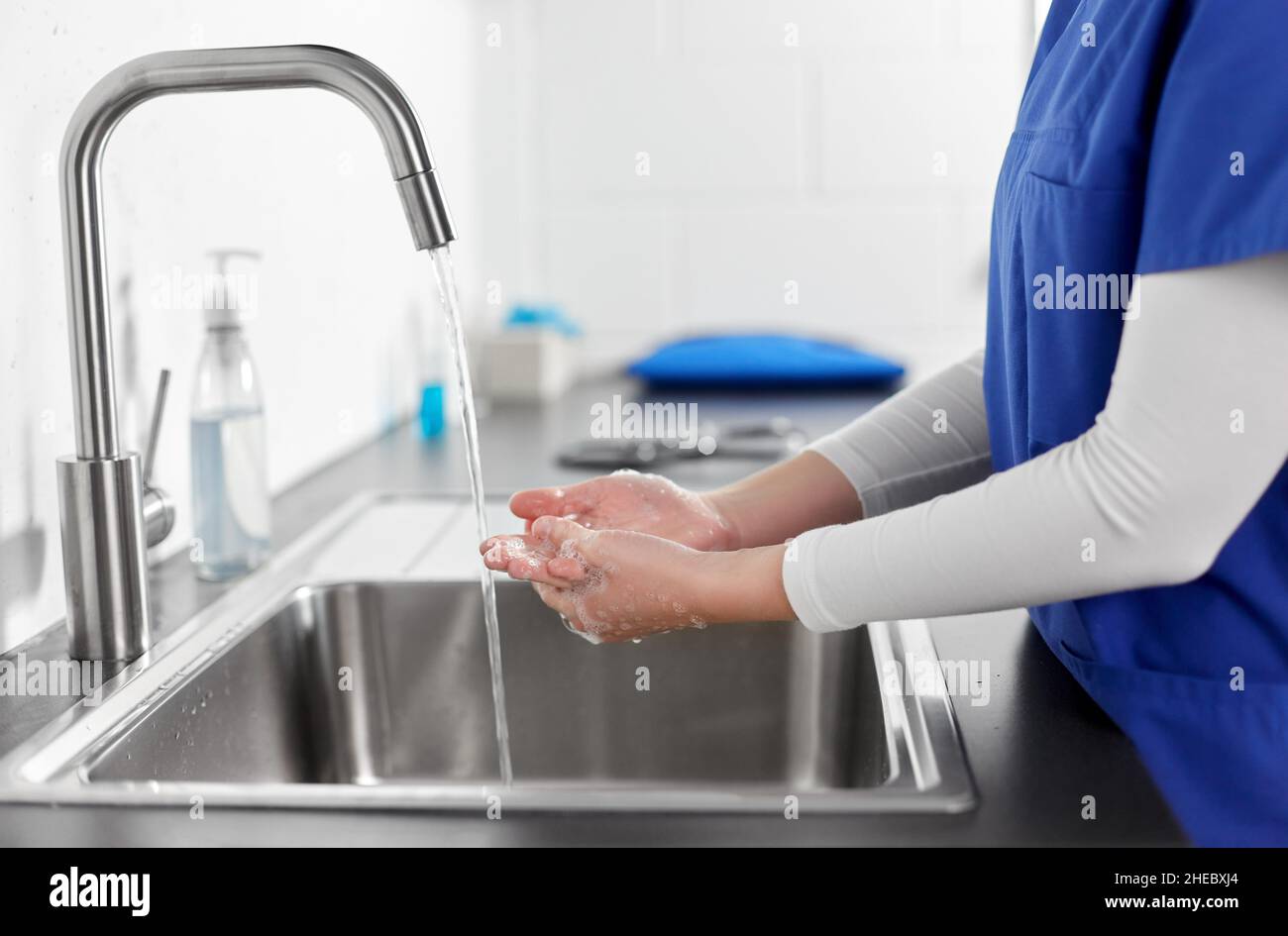 doctor or nurse washing hands with liquid soap Stock Photo - Alamy