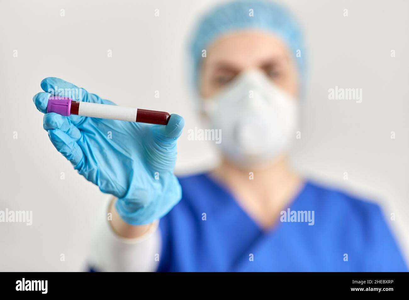 Doctor holding beaker blood hi-res stock photography and images - Alamy