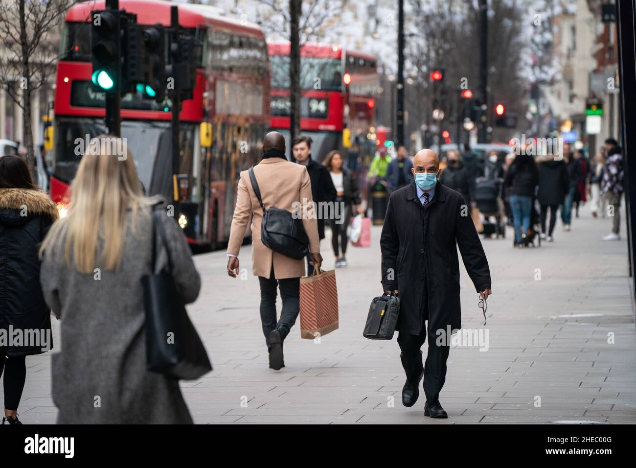 People wearing face masks on Oxford Street, in central London. Picture ...