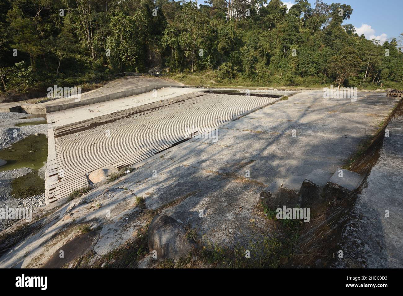 Slope after gravel separating grid of Neora dam across river Neora in ...