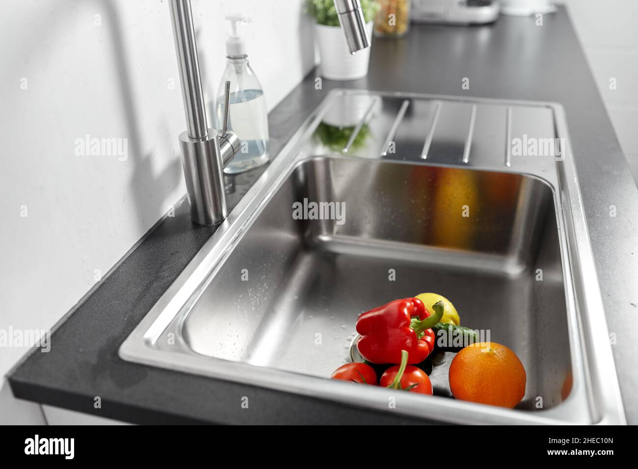 fruits and vegetables in kitchen sink Stock Photo - Alamy