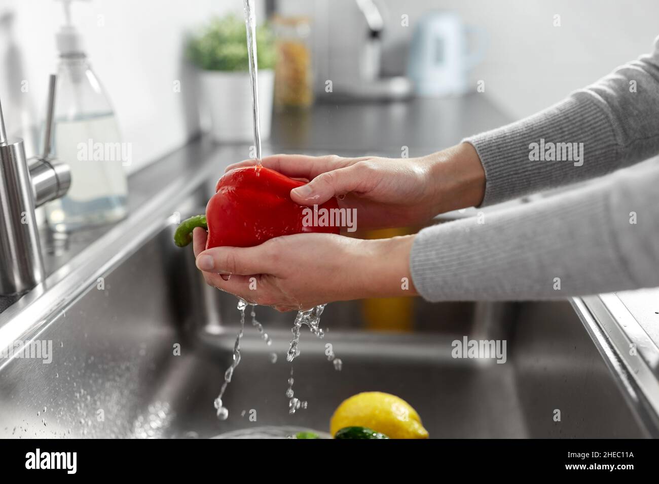 Woman washing ripe orange hi-res stock photography and images - Alamy