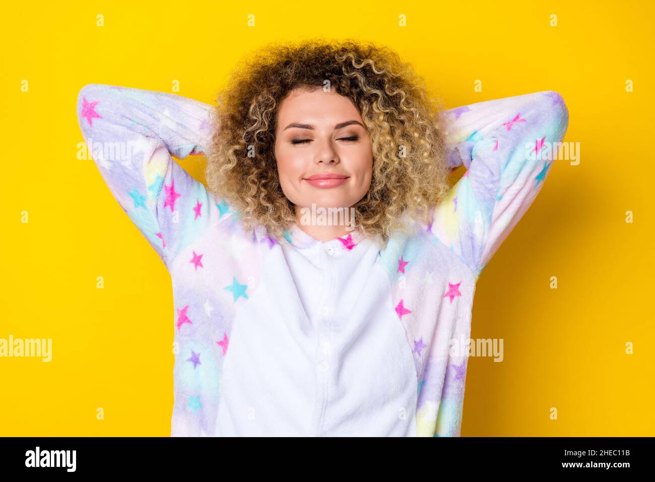 Portrait of attractive cheery dreamy wavy-haired girl in pajama ...