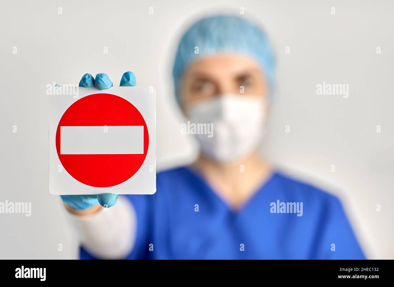 doctor or nurse in face mask showing stop sign Stock Photo - Alamy
