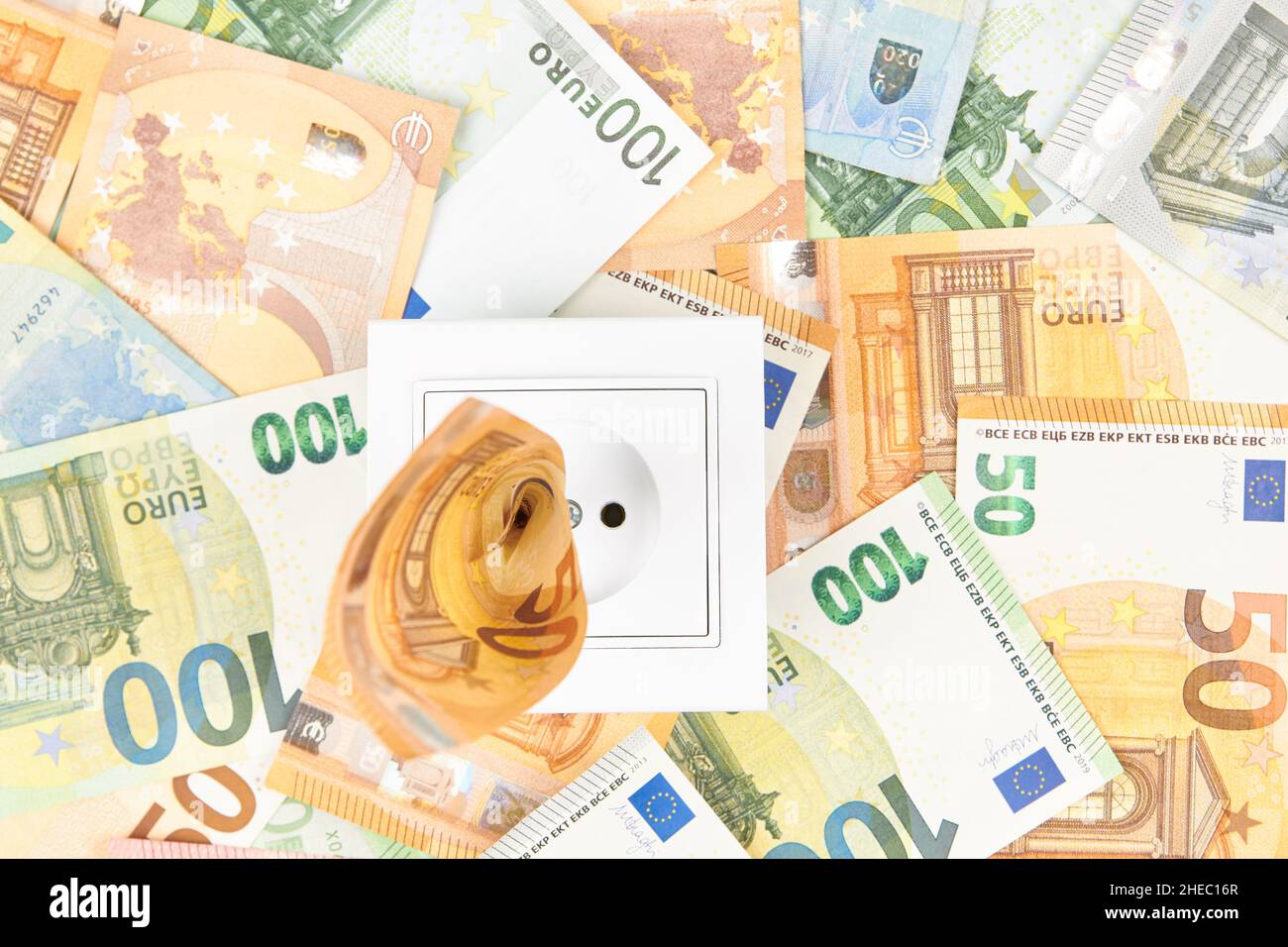 Increasing cost of electricity, expensive energy concept. White socket ...