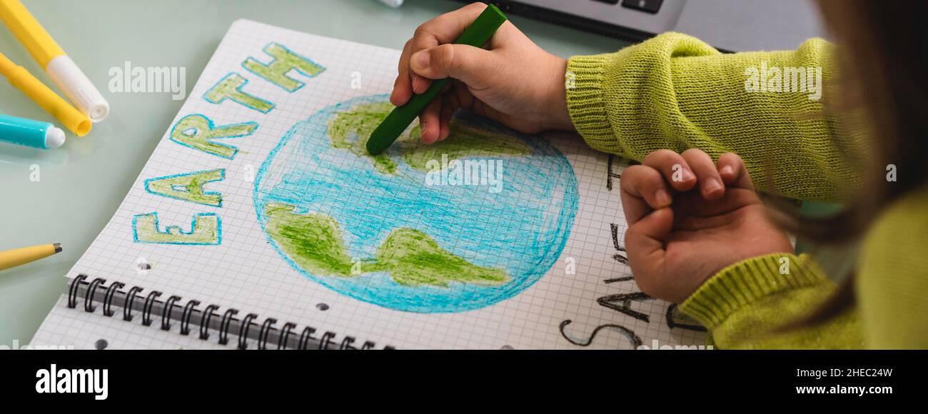 Horizontal banner or header with wide angle view of child girl draws ...