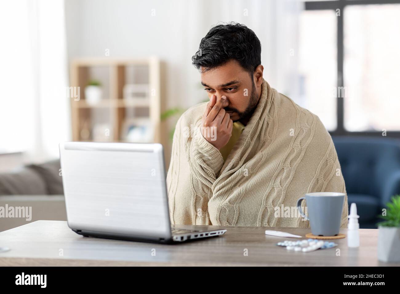 sick indian man having video call on laptop Stock Photo - Alamy