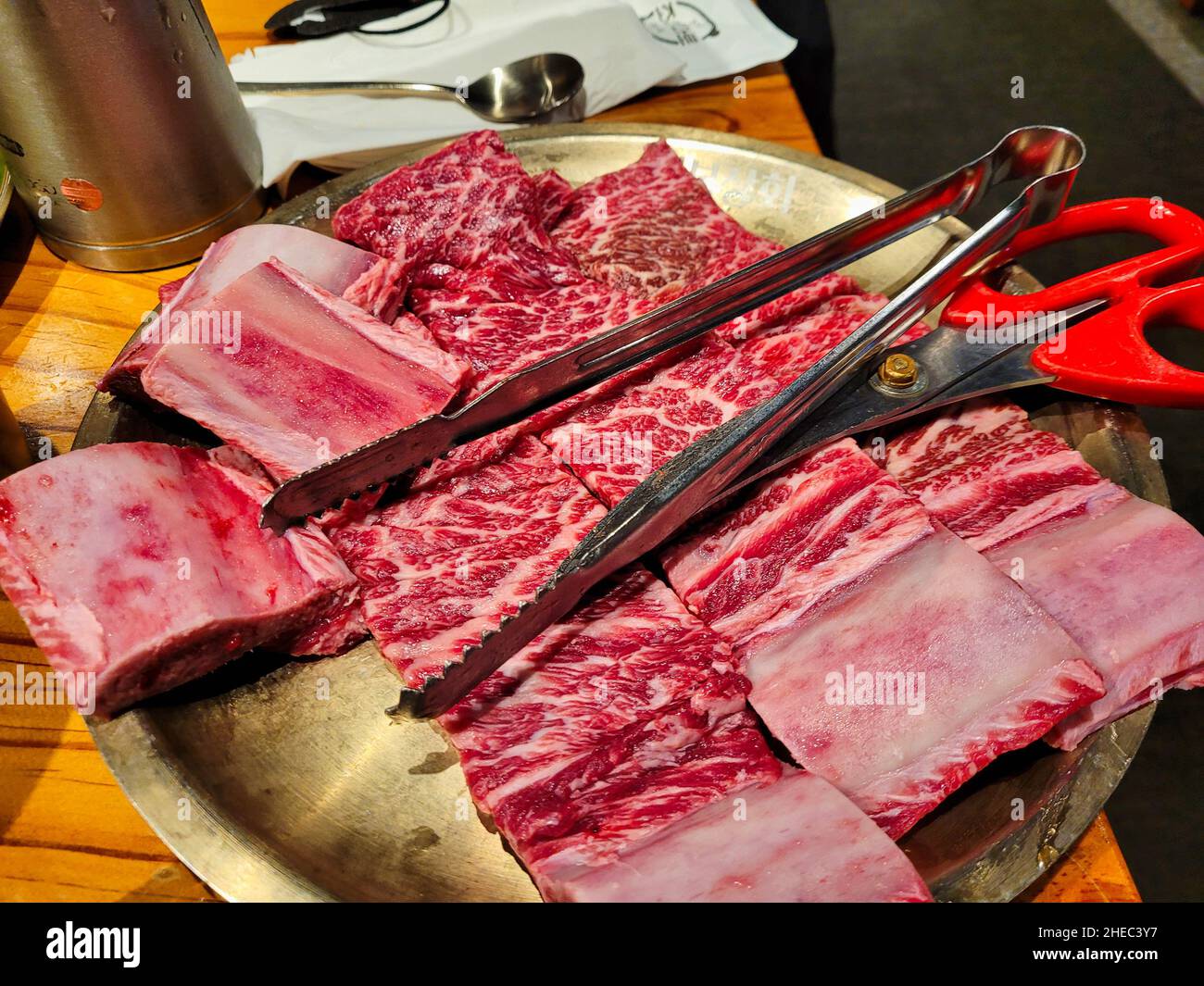 Racks of fresh meat ready to be grilled in a Korean restaurant for ...