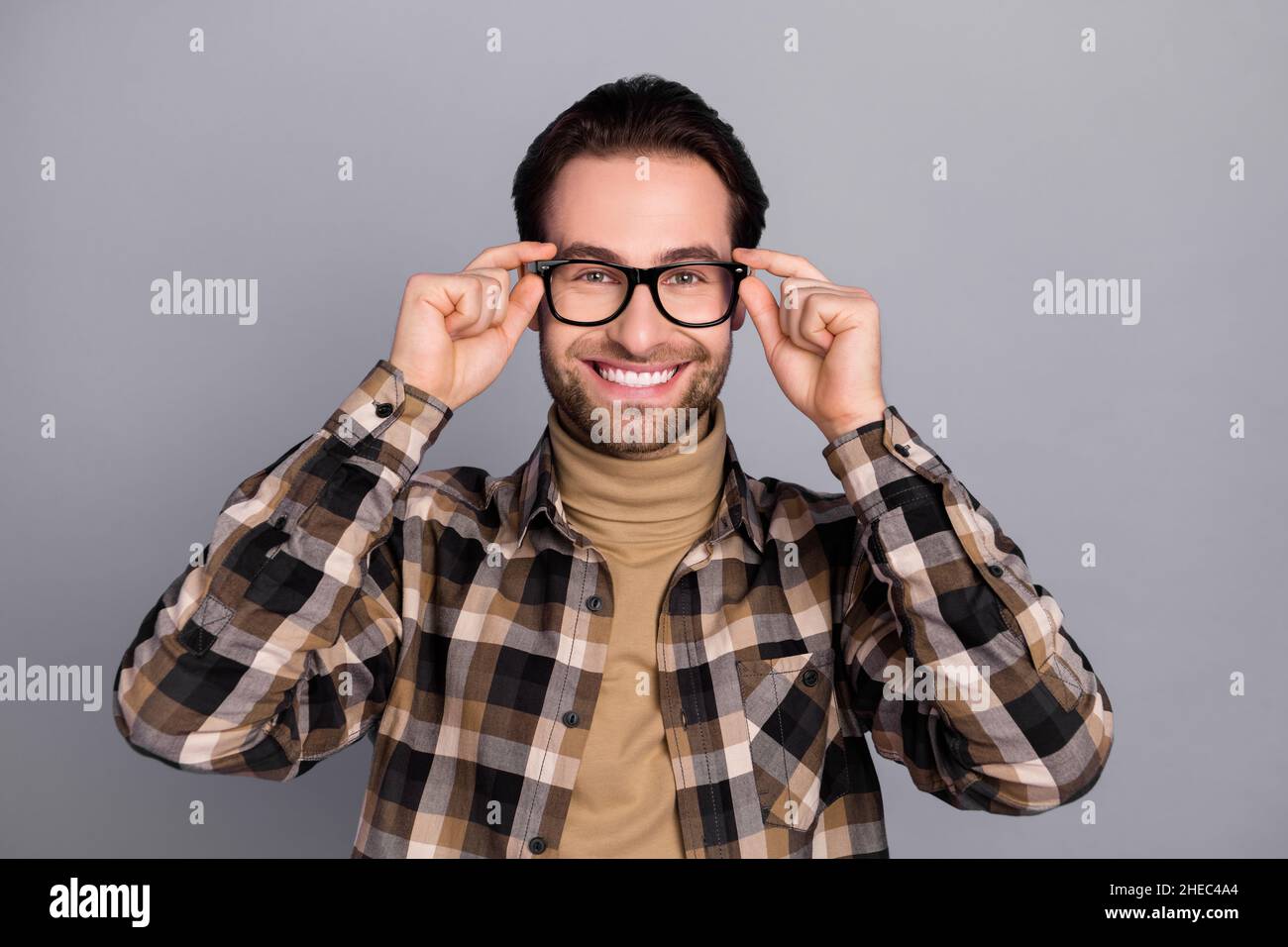 Portrait of attractive cheerful skilled guy expert specialist touching ...