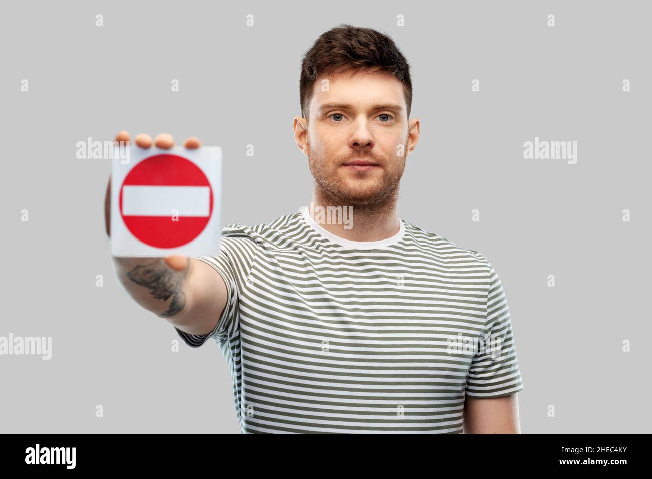 young man showing stop sign Stock Photo - Alamy