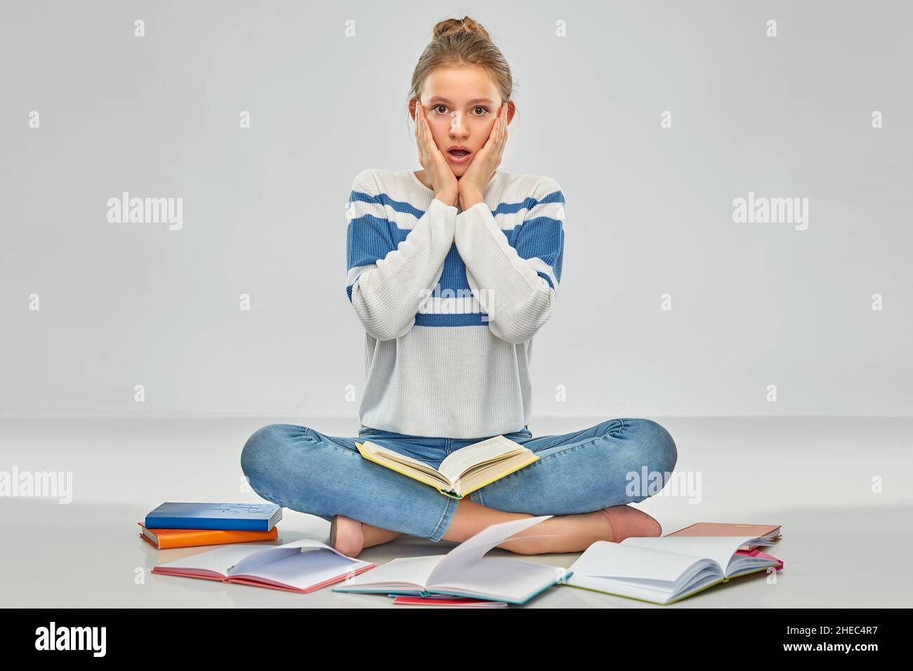 stressed teenage student girl with books Stock Photo - Alamy