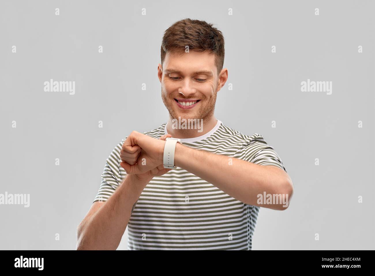 Happy looking at watch hi-res stock photography and images - Alamy