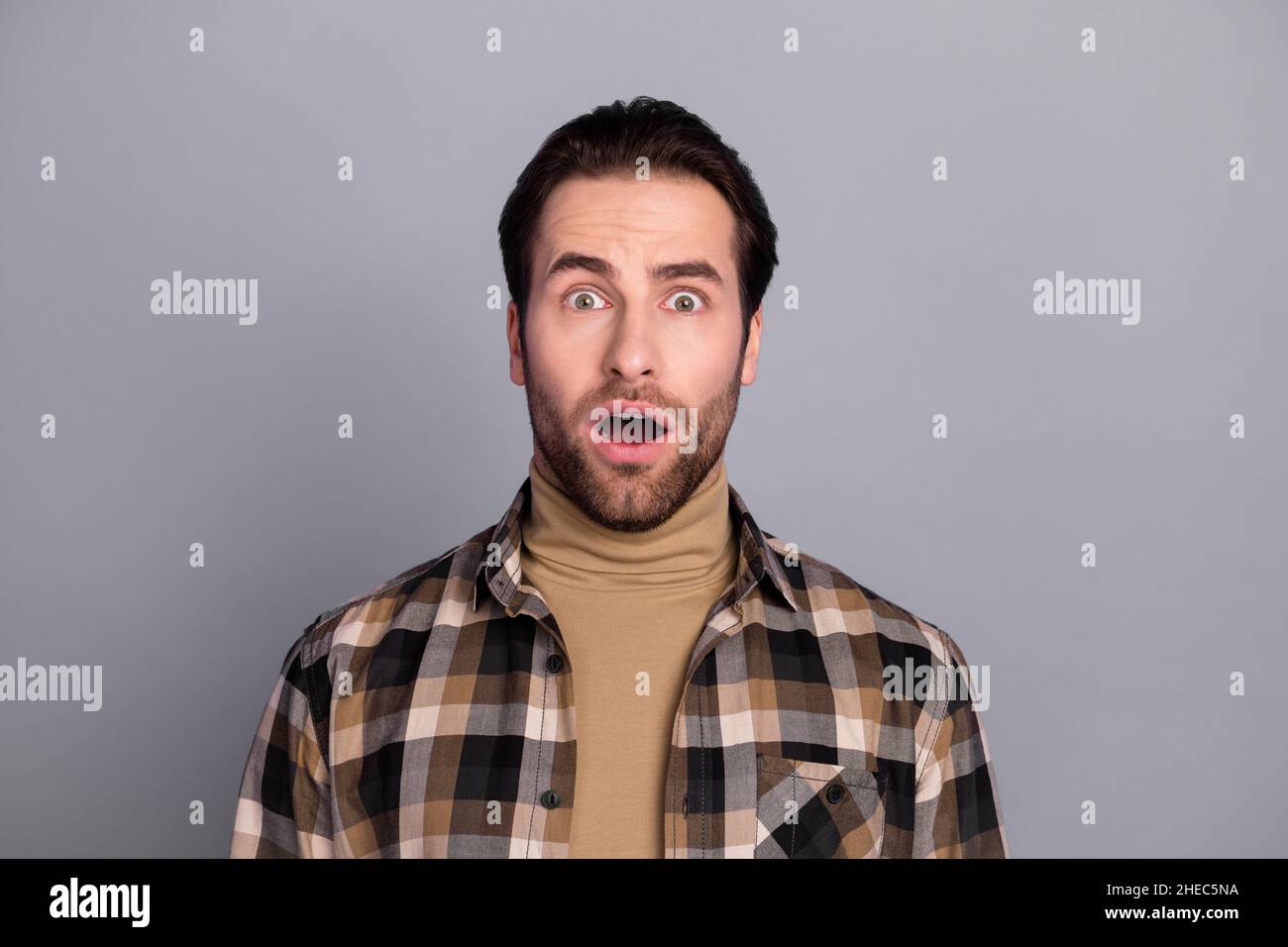 Photo of impressed scared man wear plaid shirt open mouth big eyes ...
