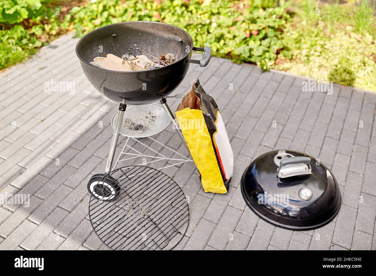 bbq grill brazier and bag of charcoal outdoors Stock Photo - Alamy