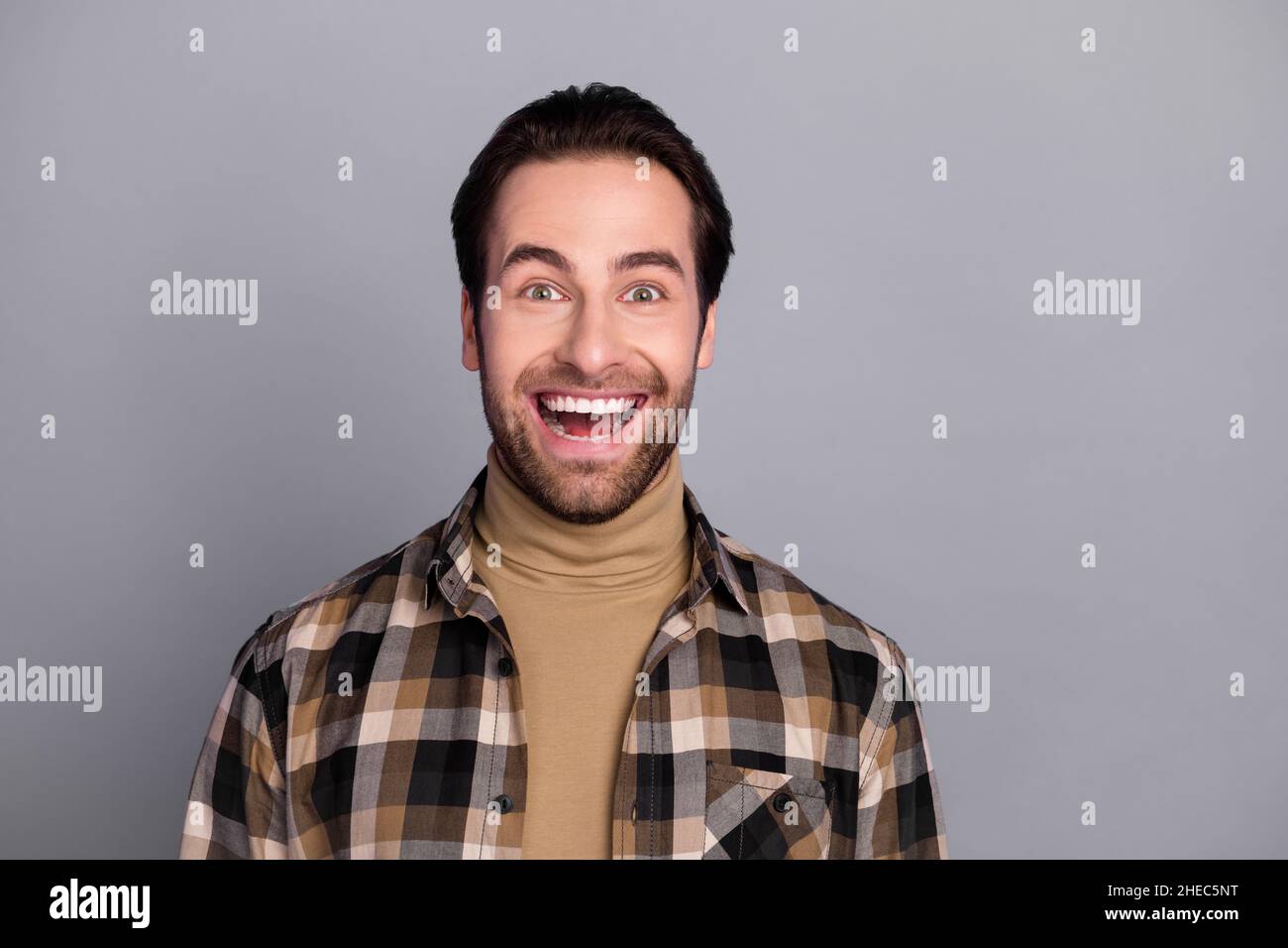 Photo of funny impressed man wear plaid shirt smiling open mouth ...