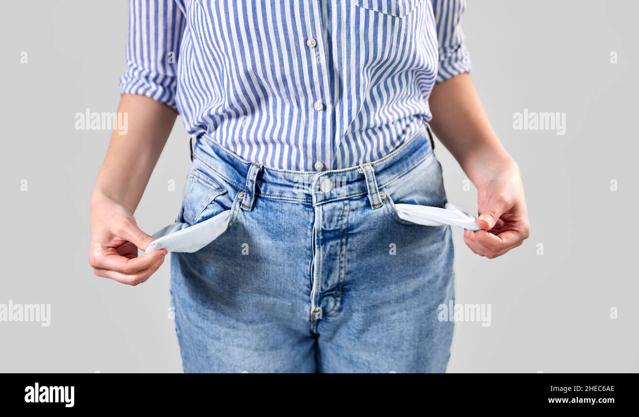 Woman showing empty pocket hi-res stock photography and images - Alamy