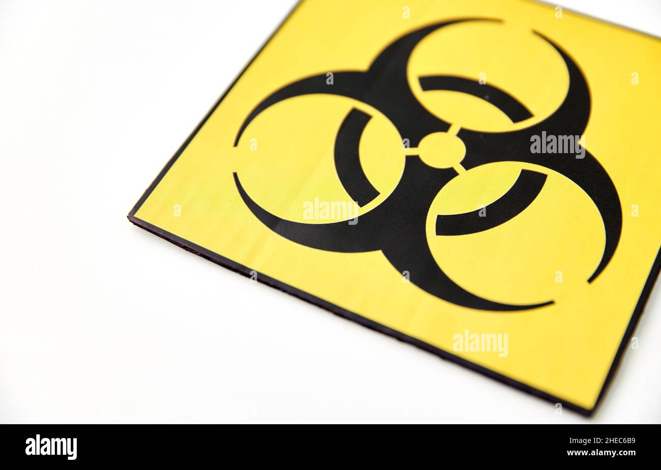 biohazard caution sign on white background Stock Photo - Alamy