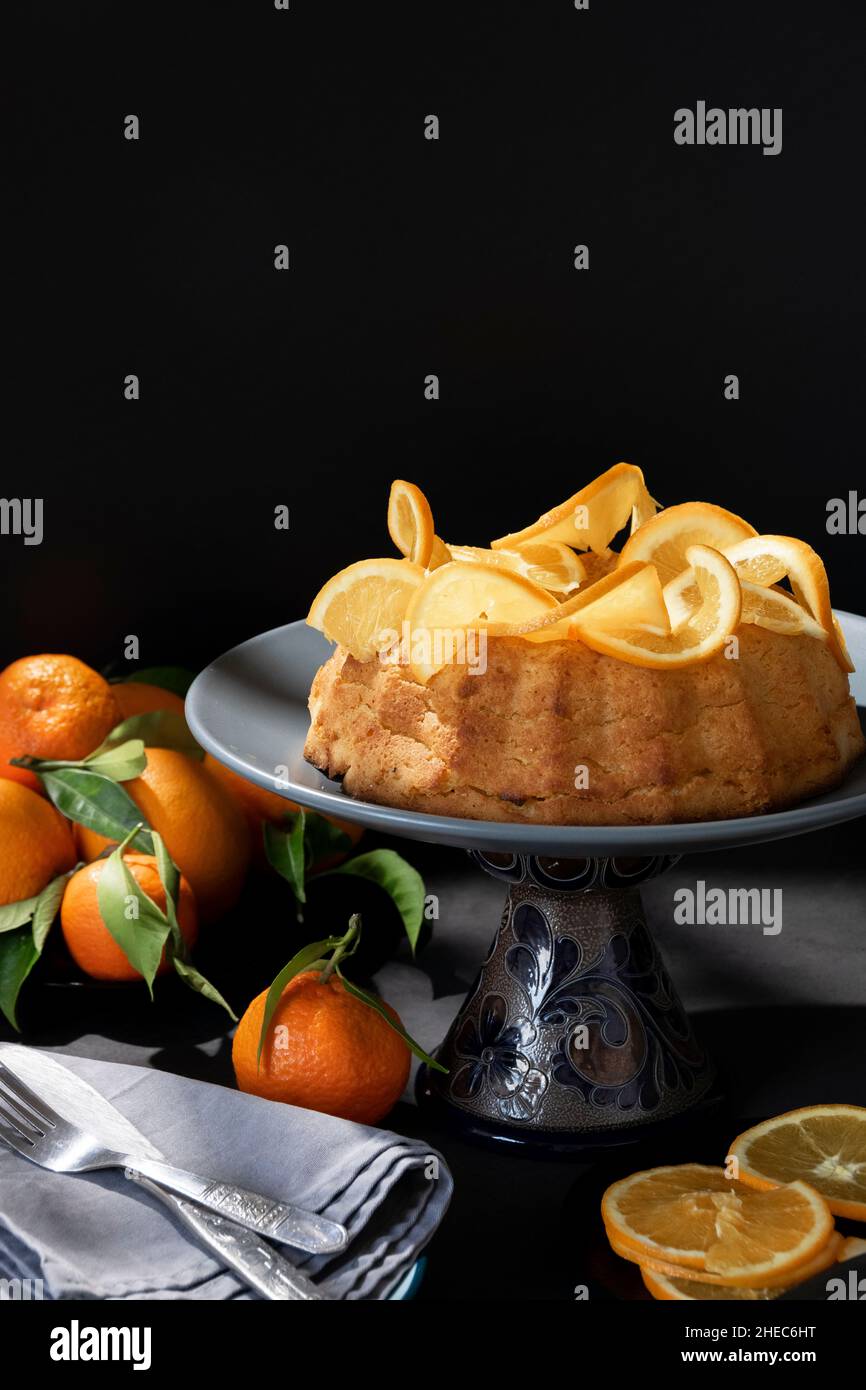 Traditional homemade orange cake, dark background, food themes Stock ...