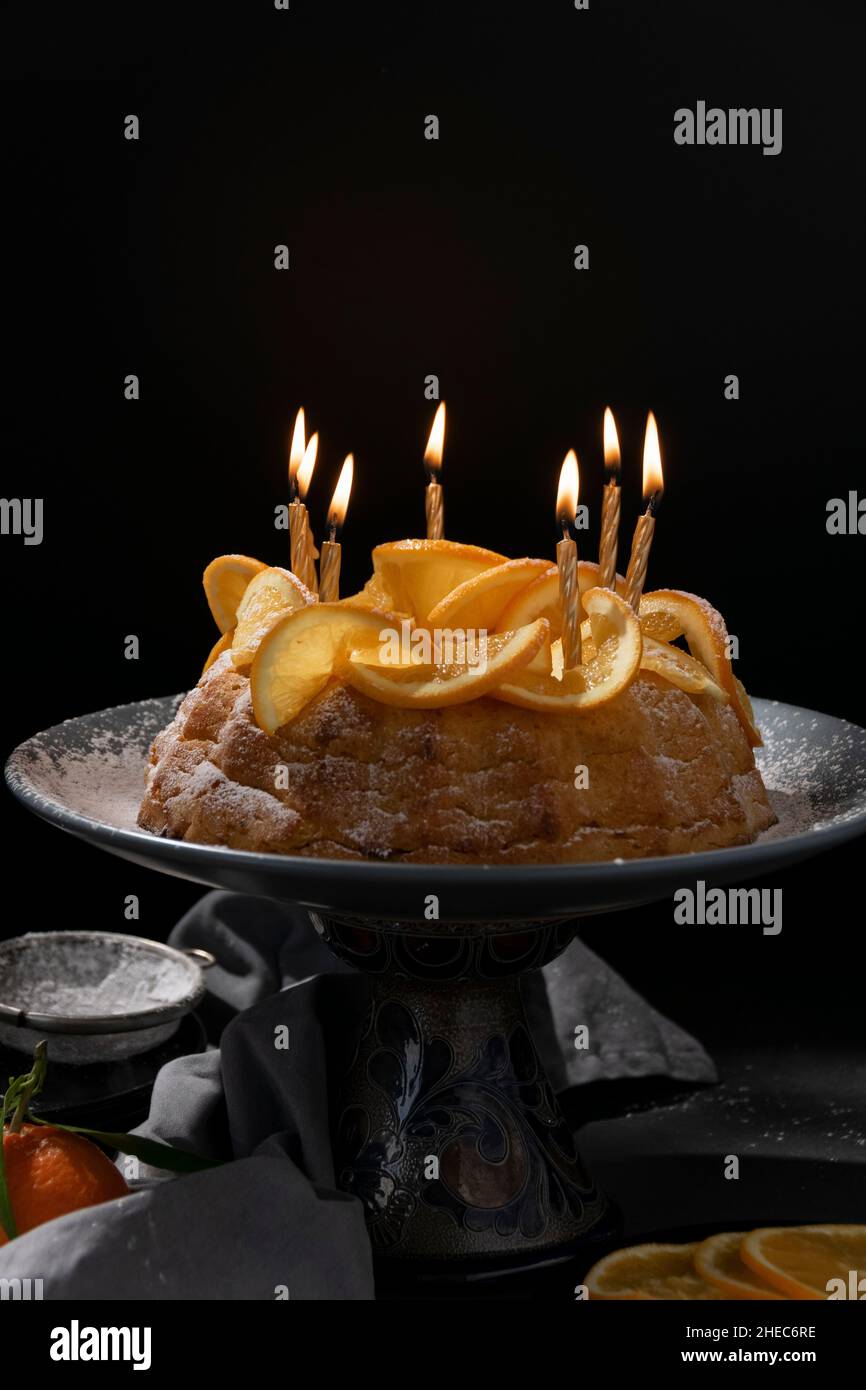 Traditional homemade orange cake, dark background, food themes Stock ...