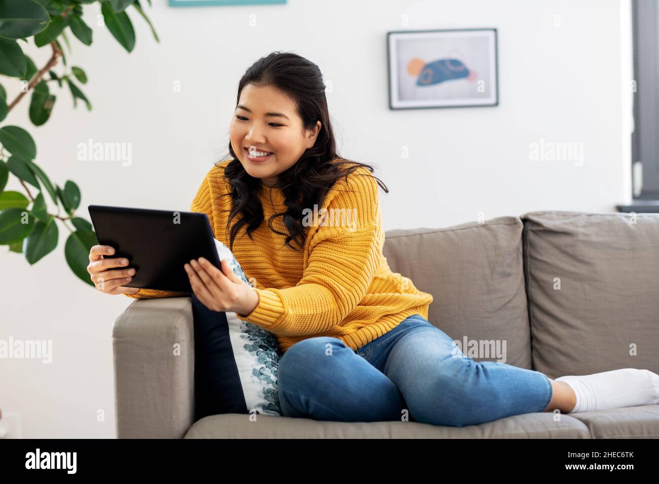 asian young woman with tablet pc computer at home Stock Photo - Alamy