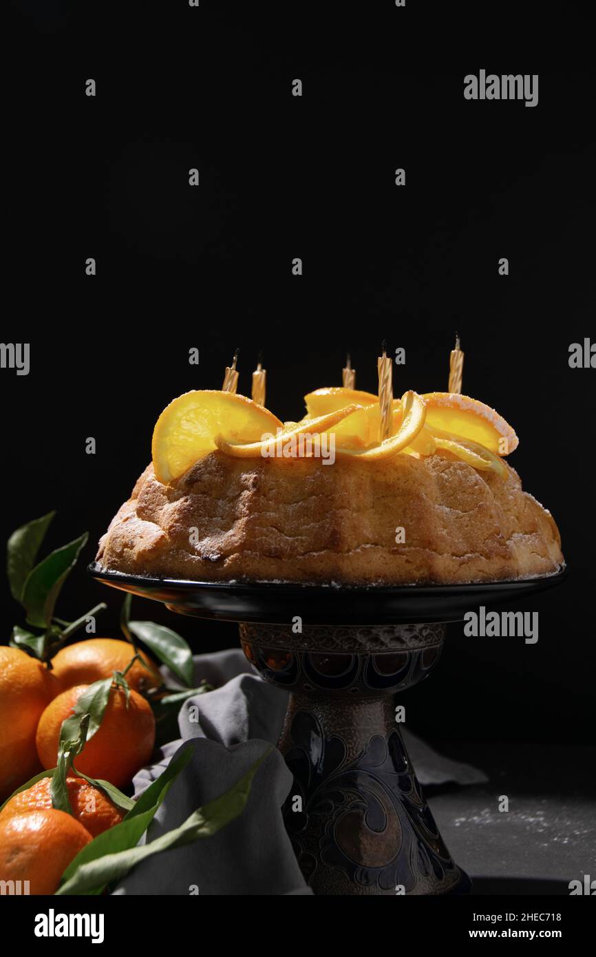 Traditional homemade orange cake, dark background, food themes Stock ...