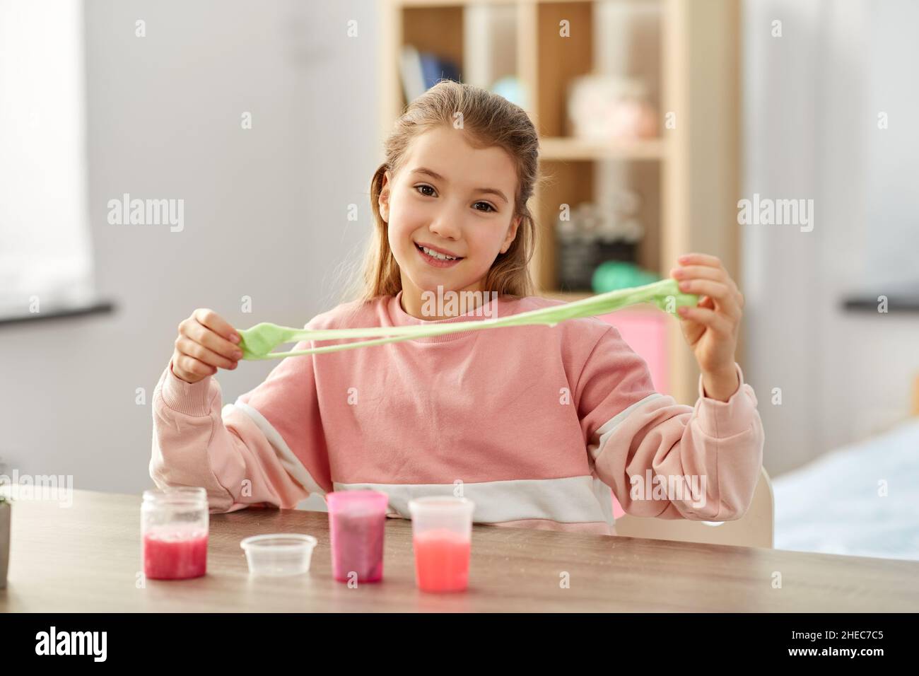 girl playing with slime at home Stock Photo - Alamy