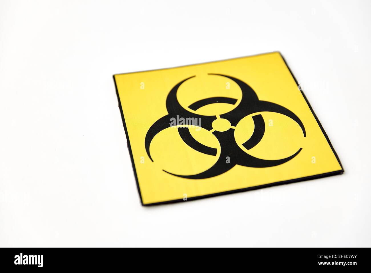 biohazard caution sign on white background Stock Photo - Alamy