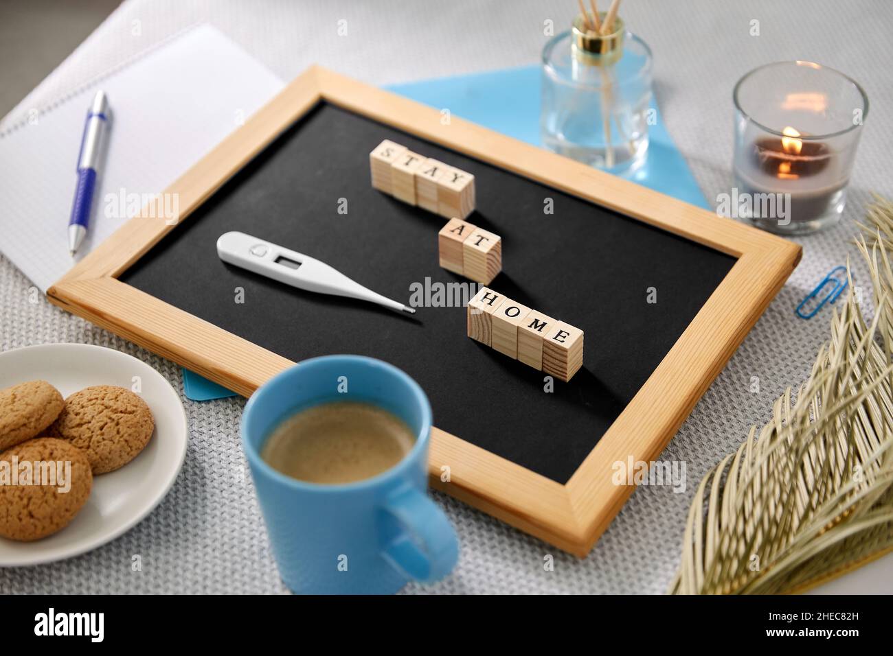 chalkboard with stay at home words on toy blocks Stock Photo - Alamy