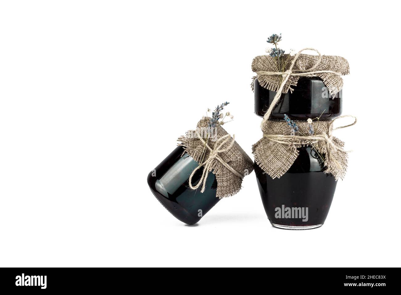 Sweet homemade blackberry jam in small beautiful glass jars decorated ...