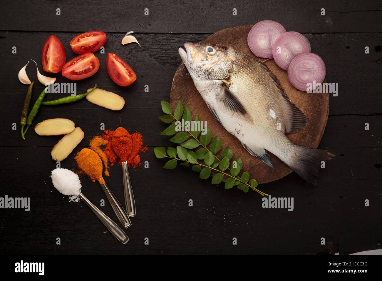 Fresh raw fish and food ingredients, Traditional Kerala style Fish ...