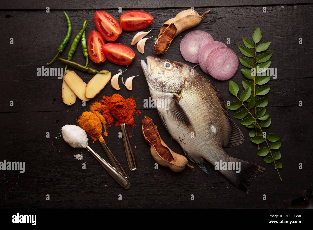 Fresh raw fish and food ingredients, Traditional Kerala style Fish ...