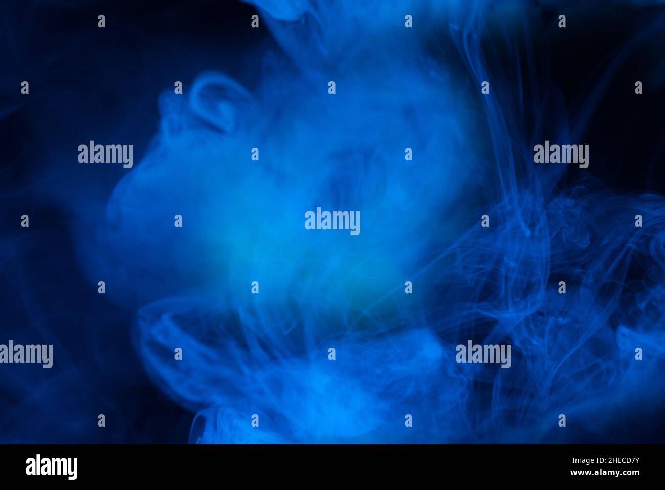 Blue steam on a black background. Copy space Stock Photo - Alamy