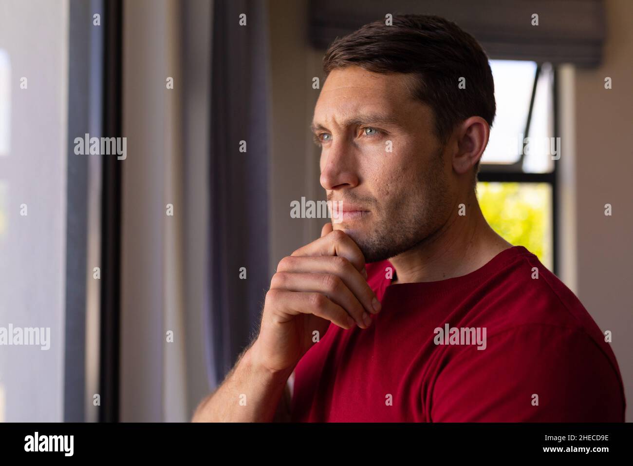 Man looking window home hi-res stock photography and images - Alamy