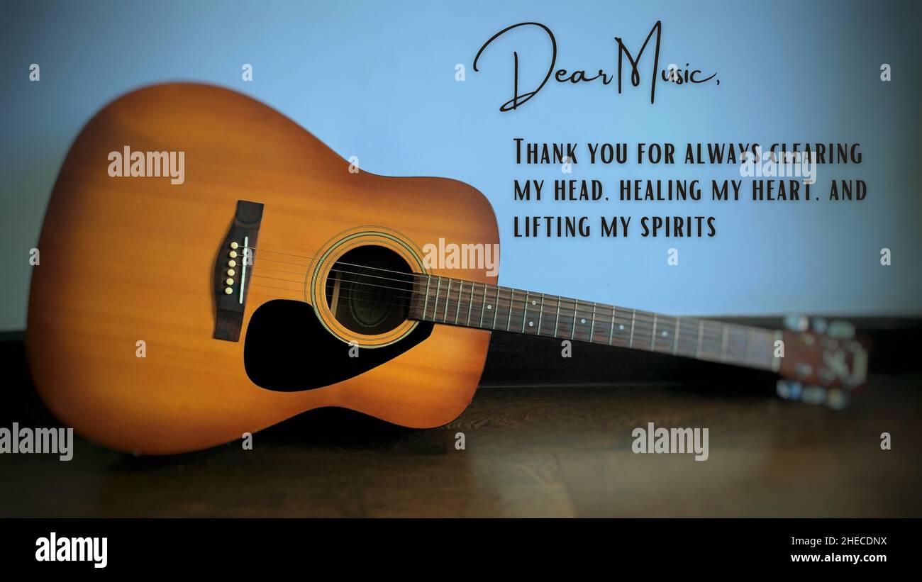 Close up of motivational and inspirational quotes with blurred guitar ...