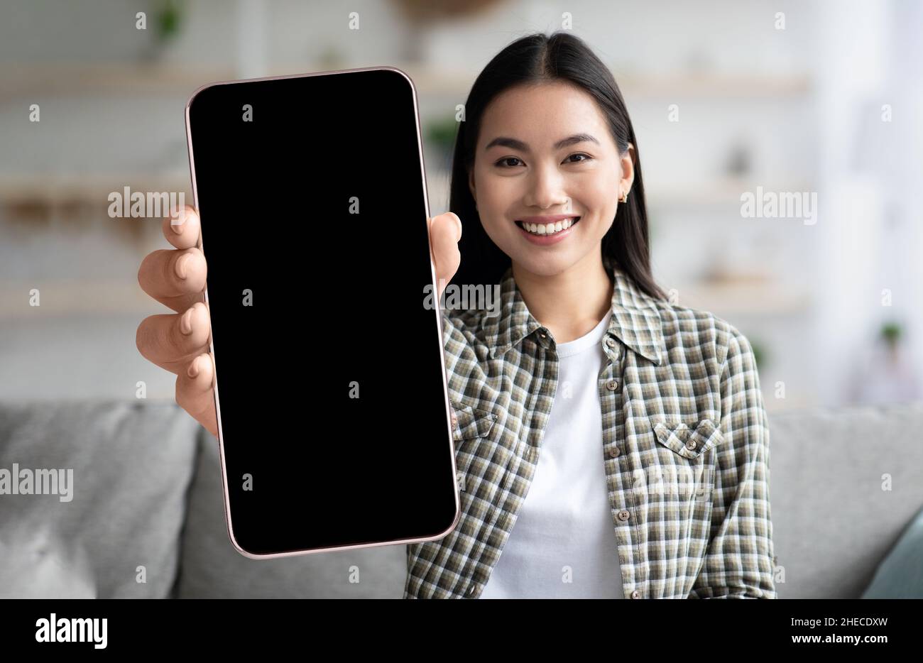 Happy Asian Woman Showing Big Smartphone With Blank Blank Screen At ...