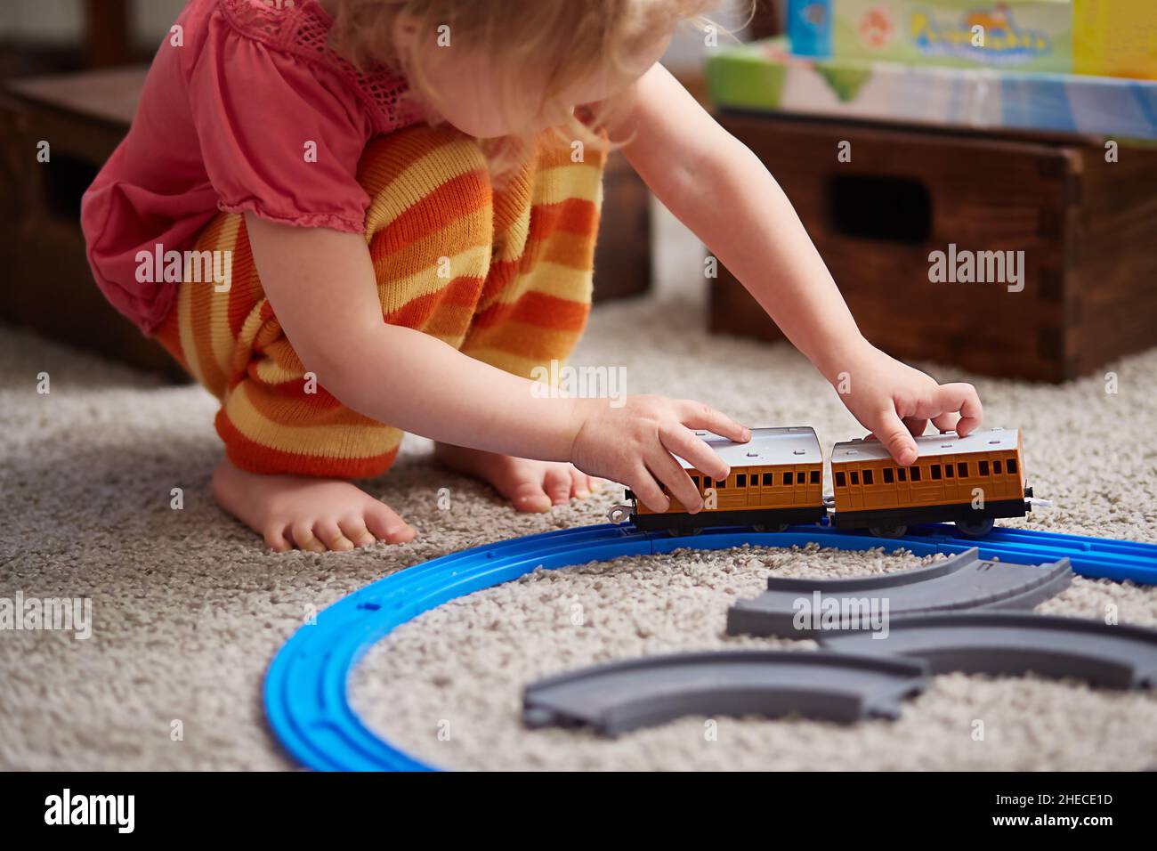 girl is playing with a train. Educational toys for preschool and ...