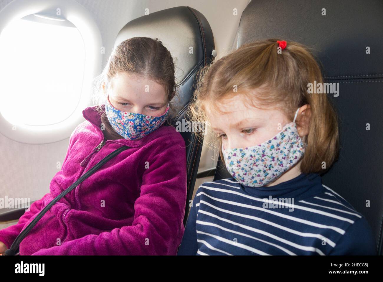 Child siblings children wearing face covering masks against COVID-19 ...