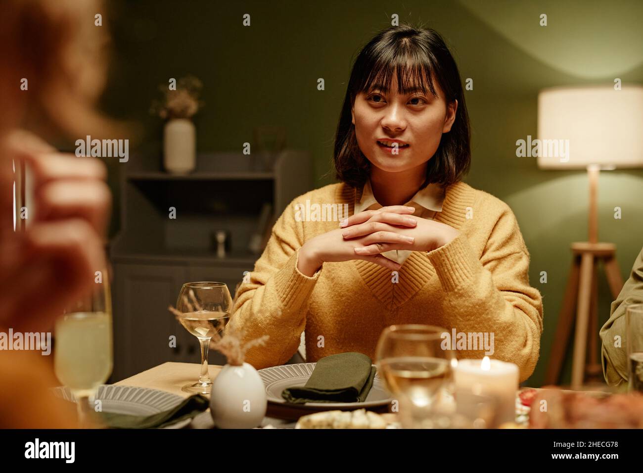 Young woman sitting dining table hi-res stock photography and images ...
