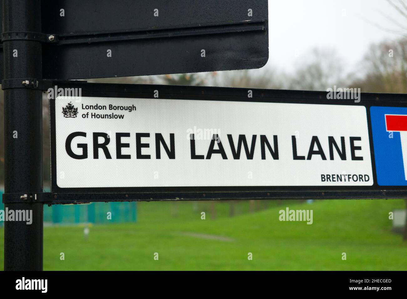 Green Lawn Lane road street sign post & / park parkland with long cut ...