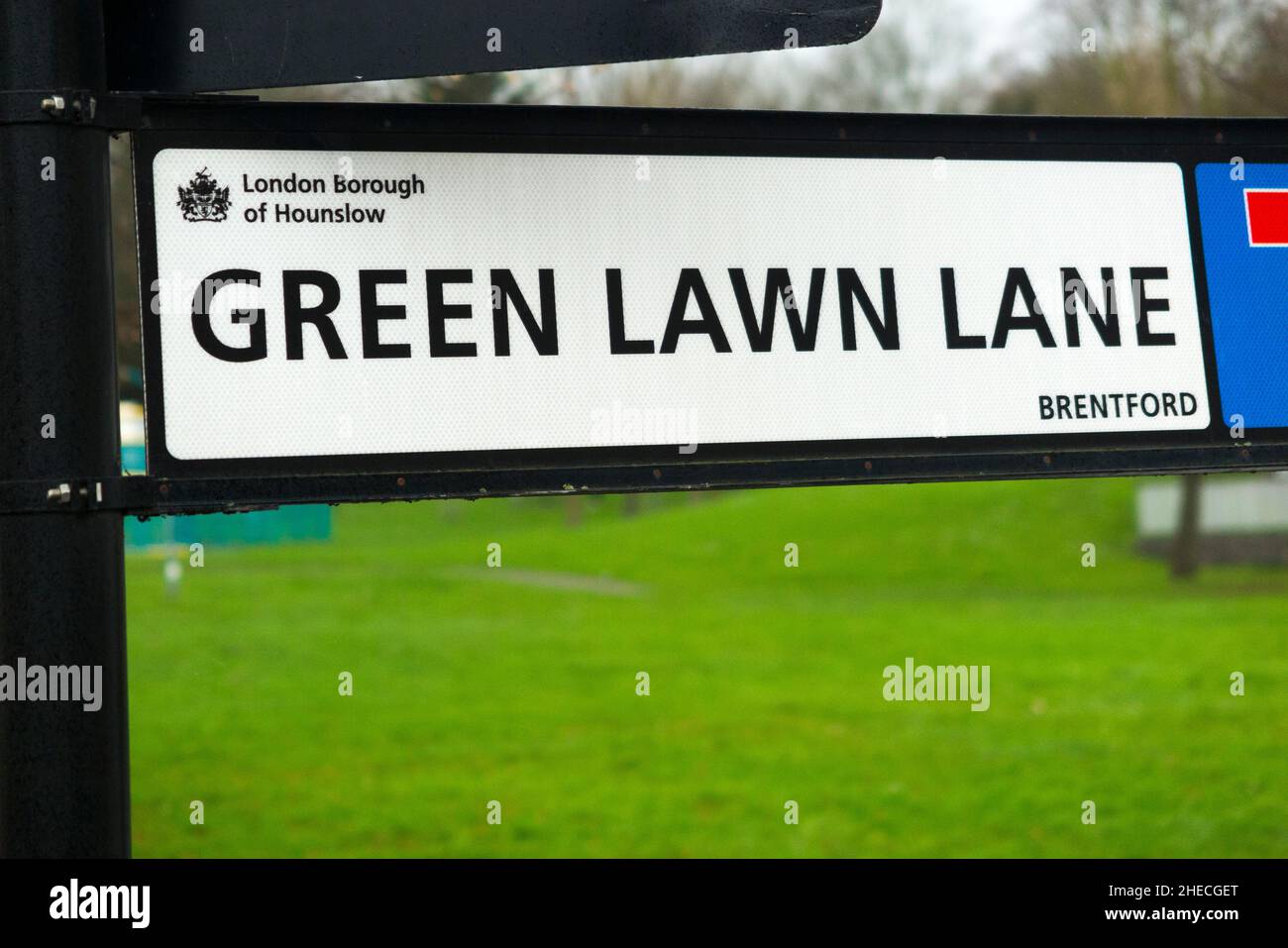 Green Lawn Lane road street sign post & / park parkland with long cut ...
