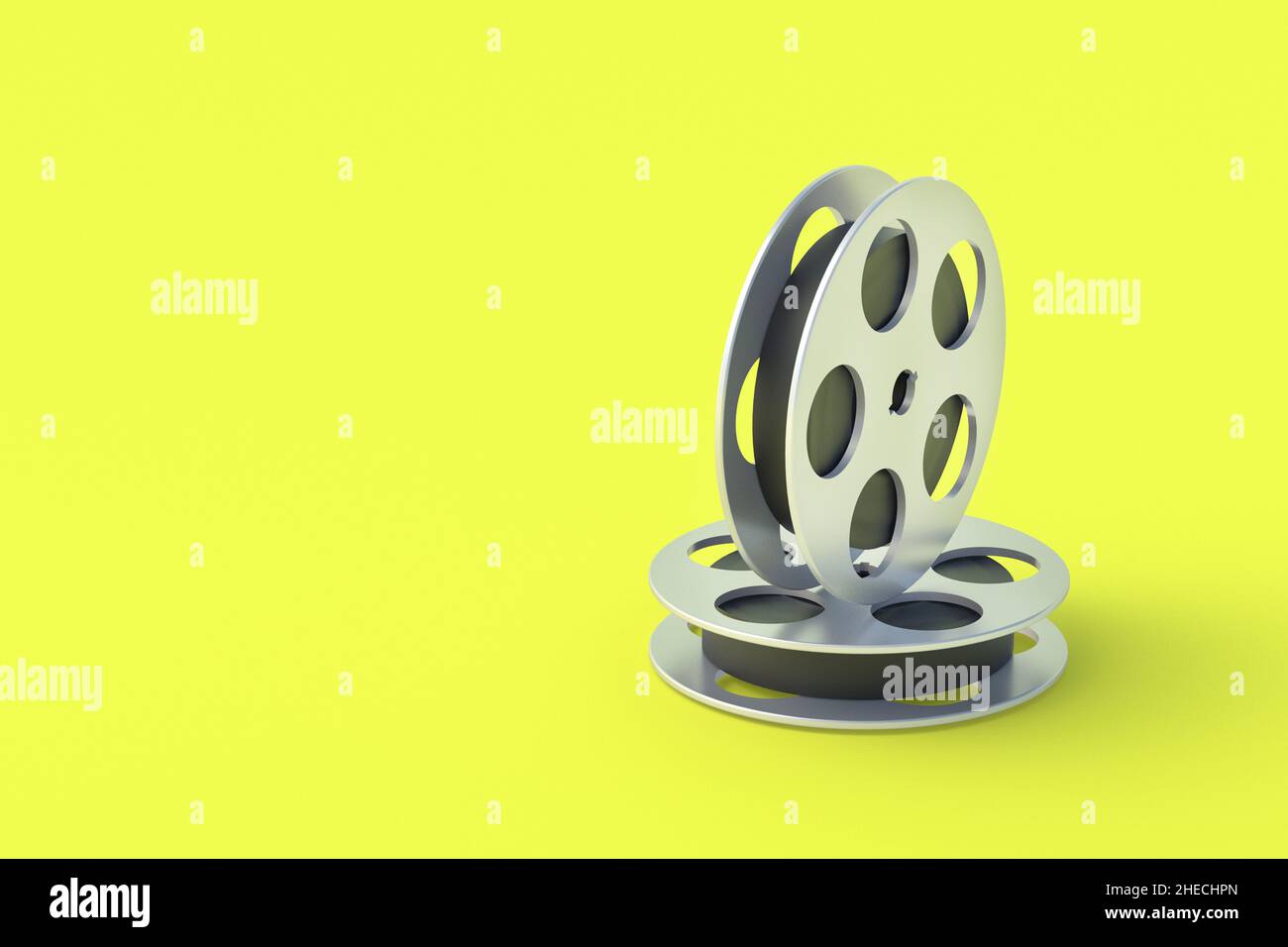 Film reel in metal frame on yellow background. Cinematography tape ...
