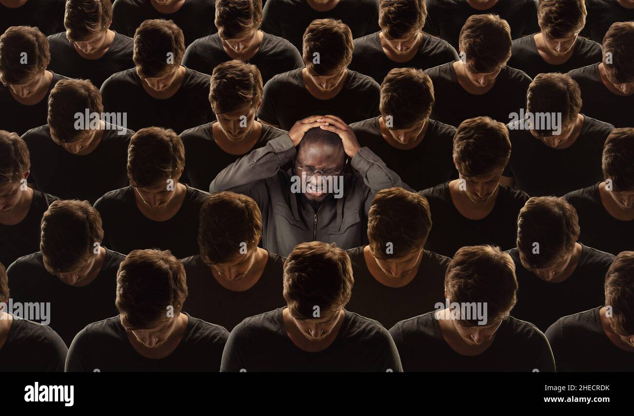 High angle view of grey crowd of identical people and special one man ...