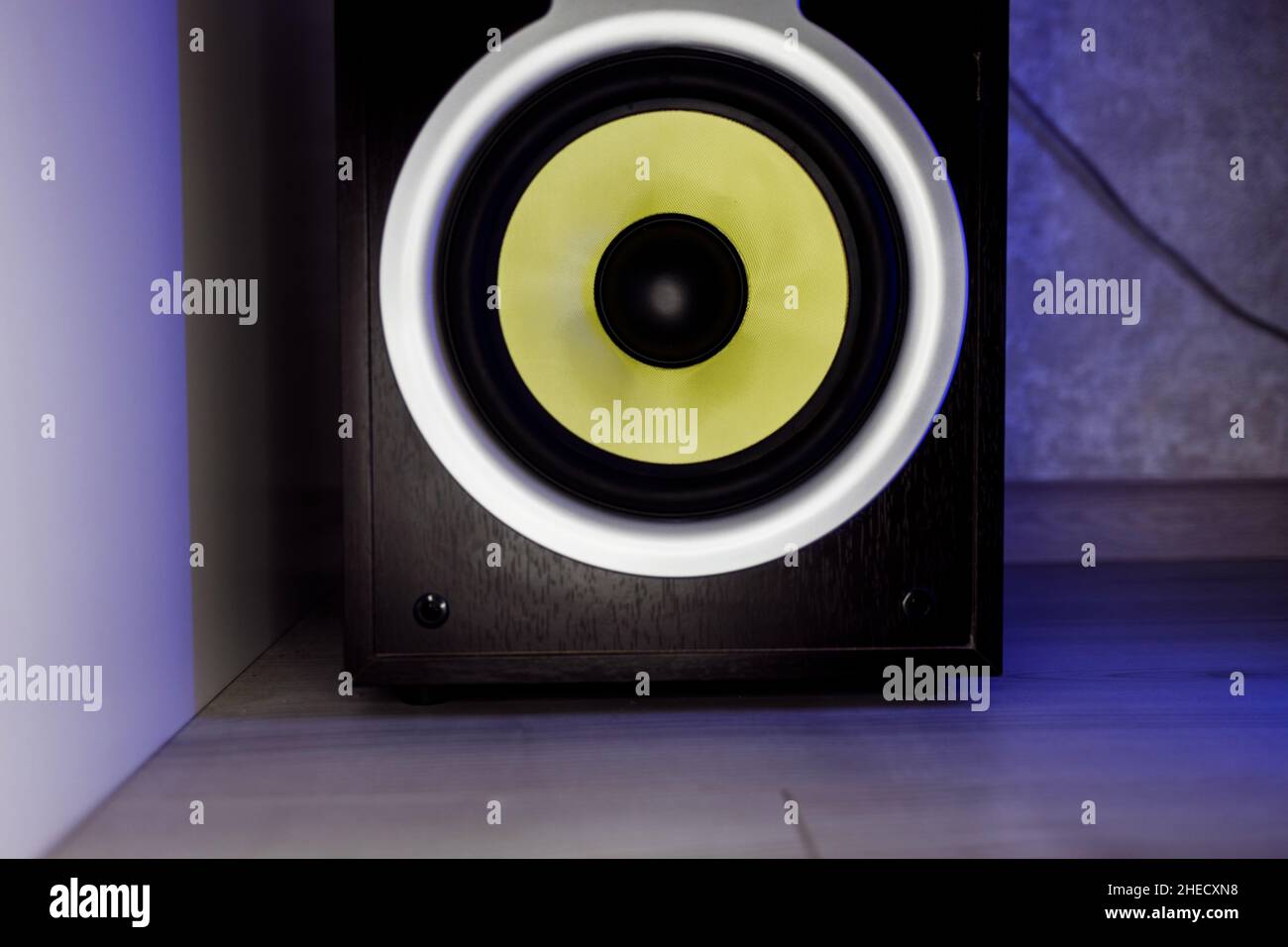 Music studio speaker, with a yellow membrane, on floor Stock Photo - Alamy