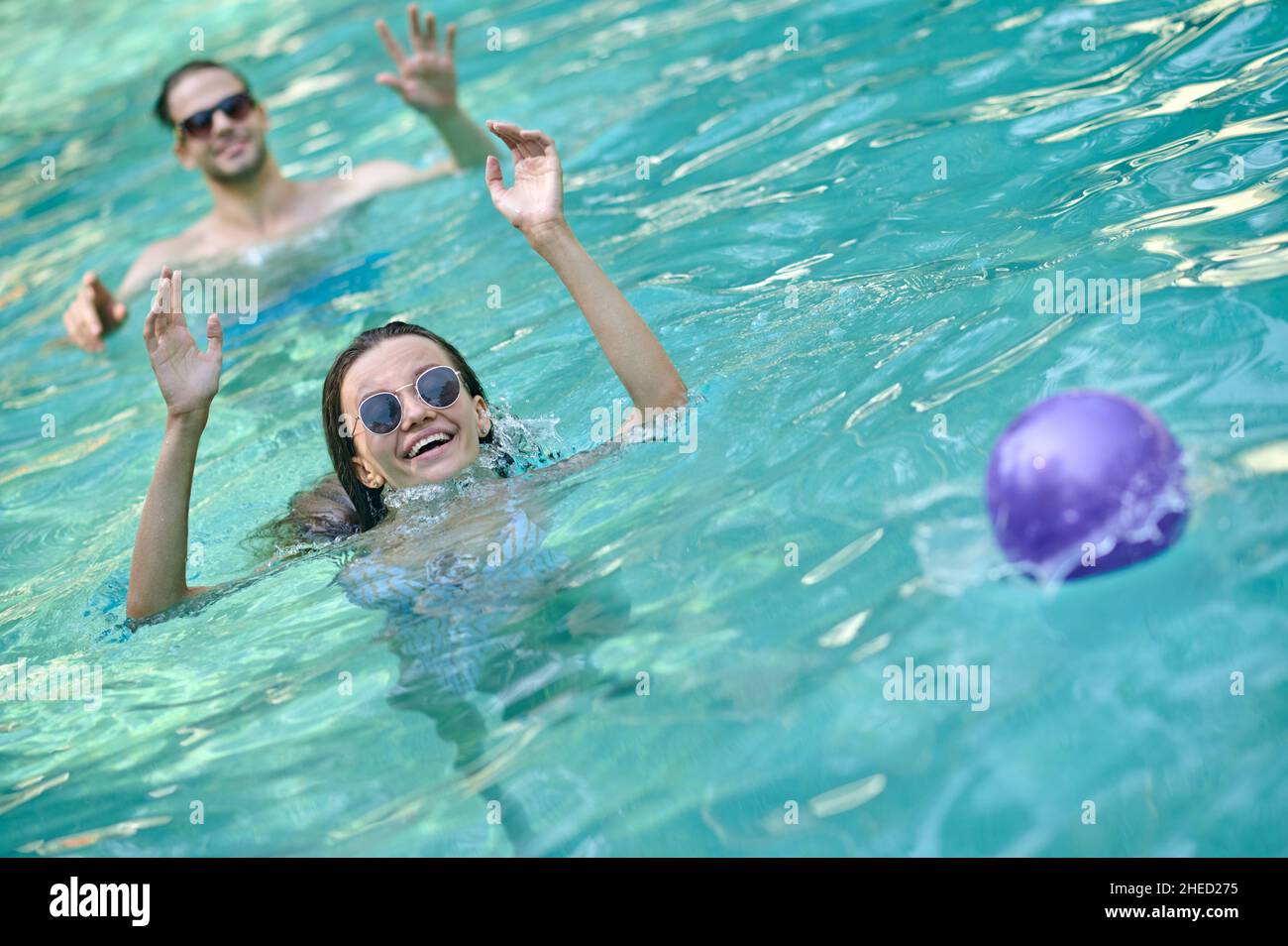 Young people having fun and enjoying at the swimming pool Stock Photo ...