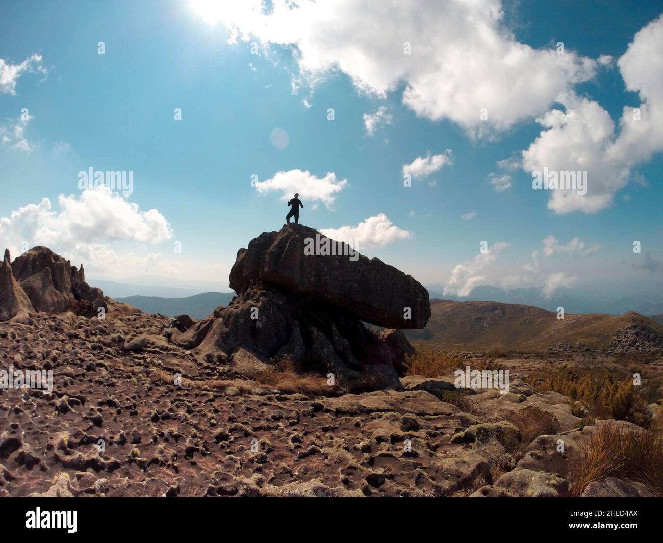Person over rock during hike Stock Photo - Alamy