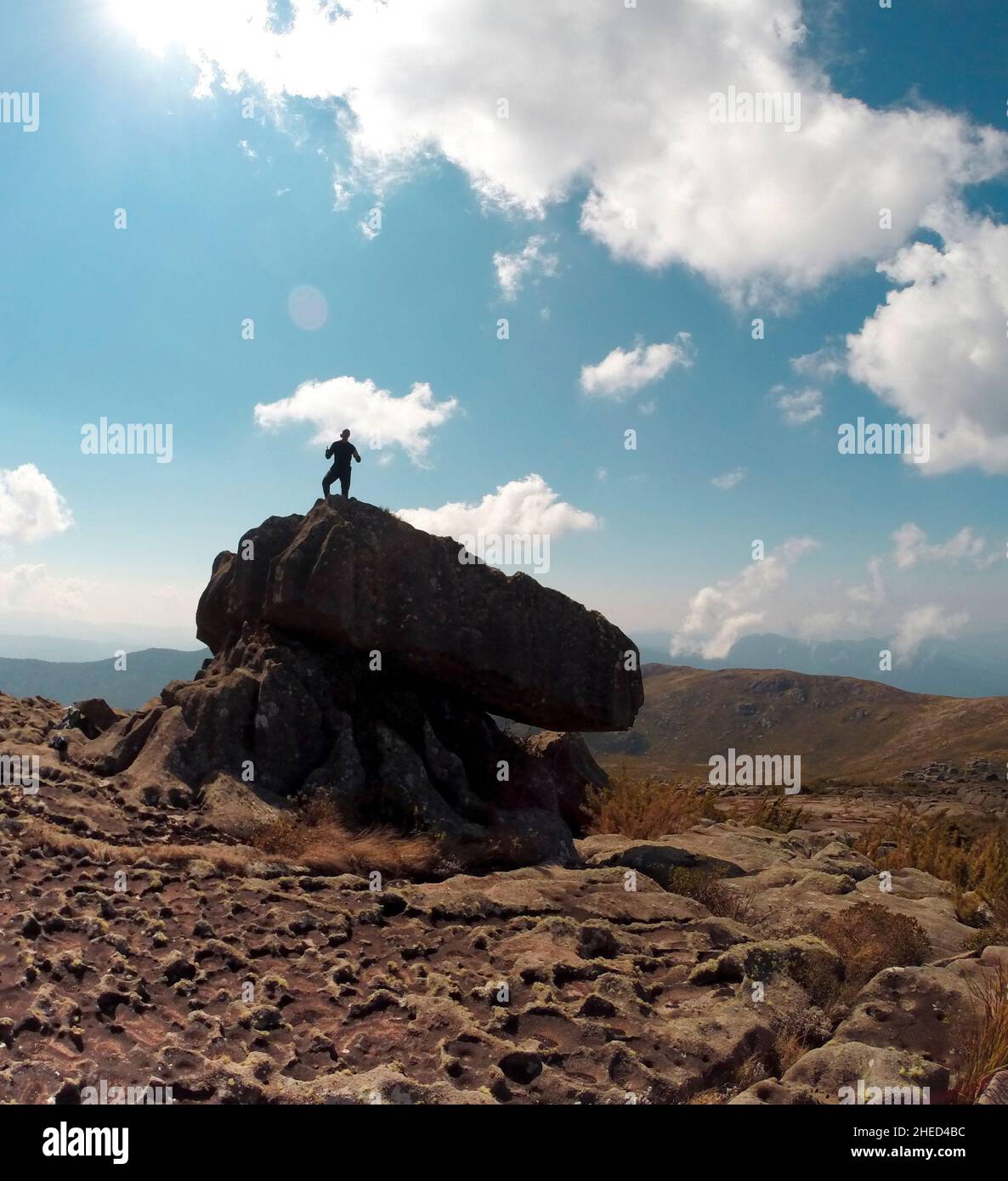 Person over rock during hike Stock Photo - Alamy