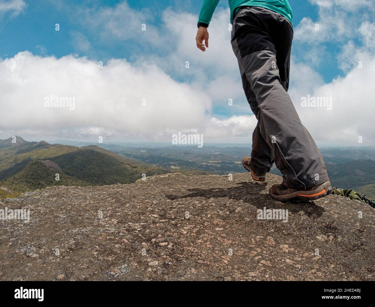 Person hiking on the rock Stock Photo - Alamy