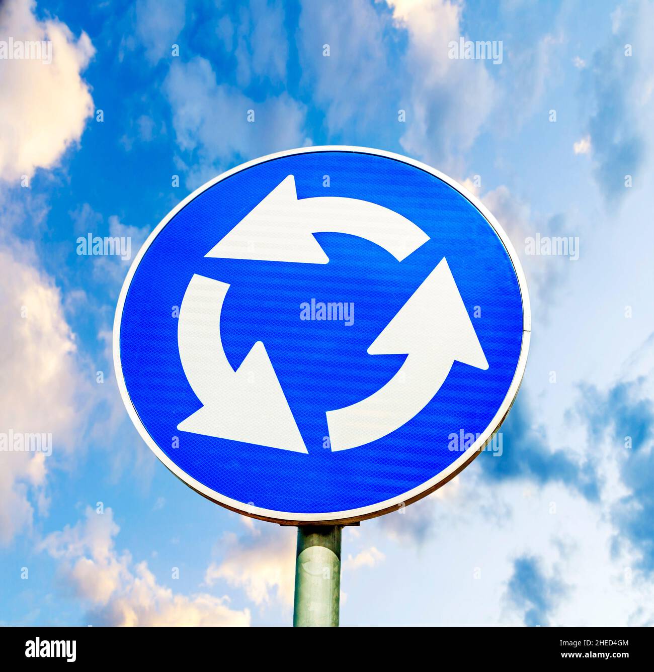 Blue roundabout crossroad road traffic Stock Photo - Alamy