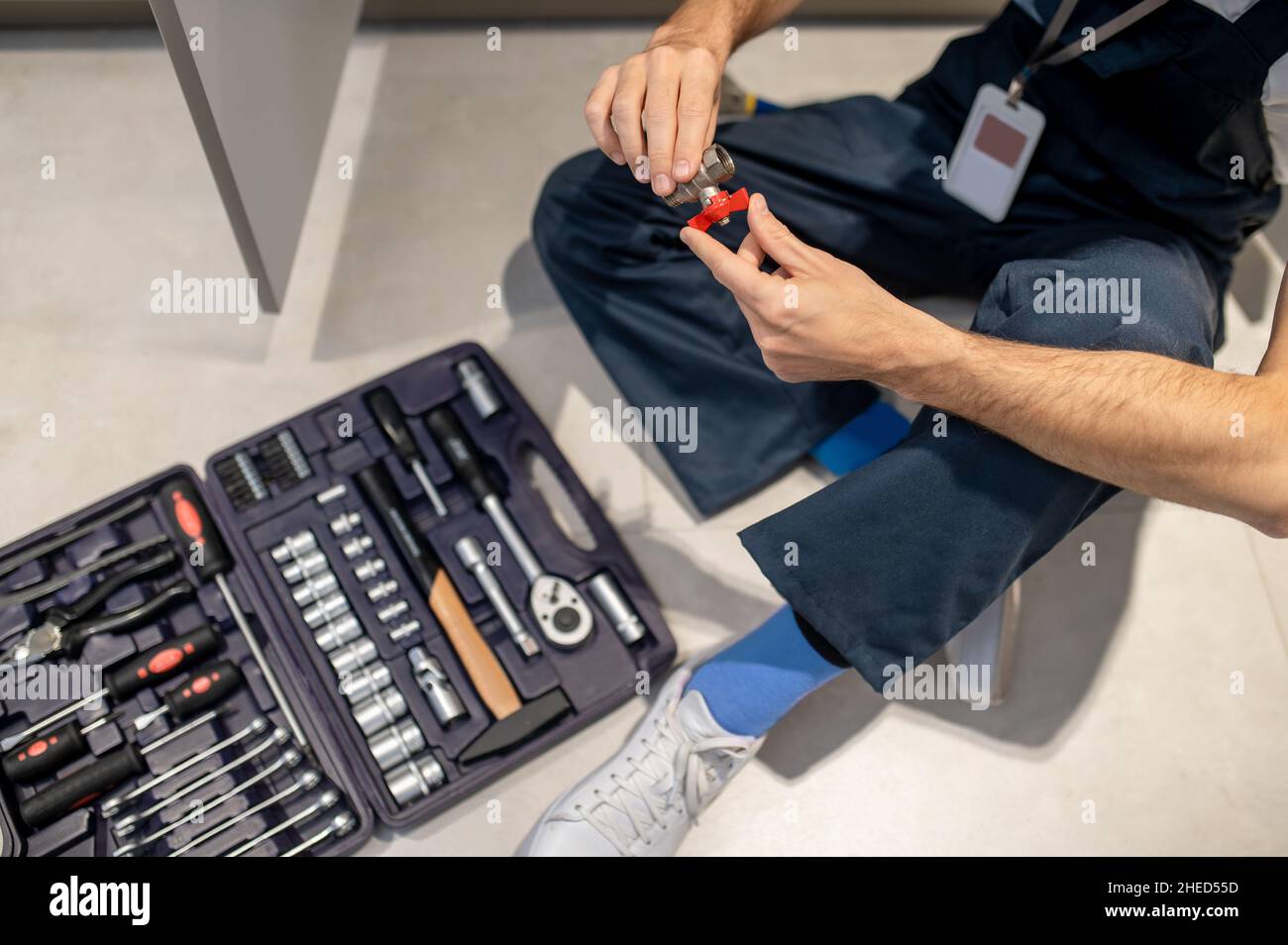 Top view of man sitting on floor with tap Stock Photo - Alamy