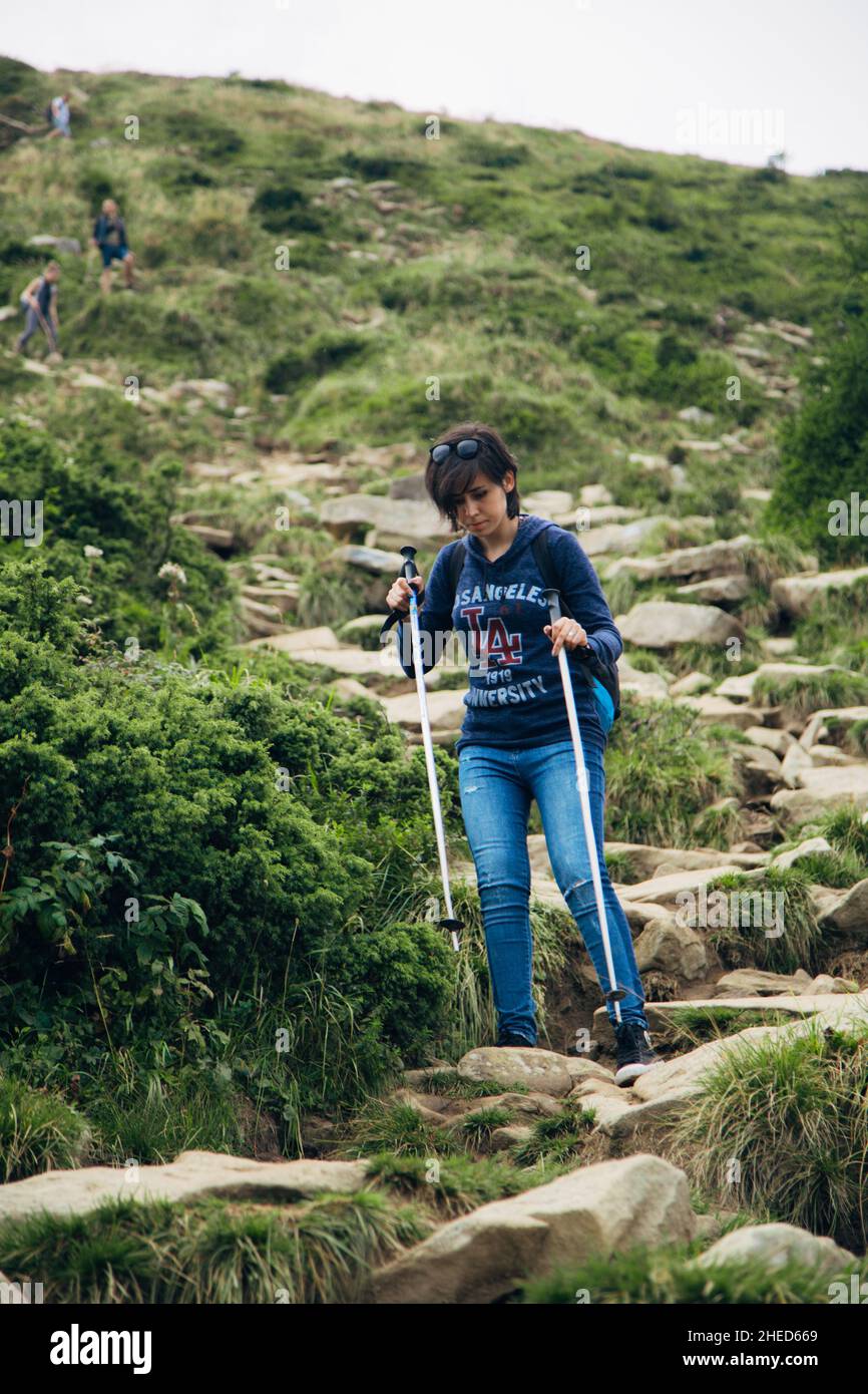 Girl Descend Down a Large Green Mountain Range Stock Photo - Alamy